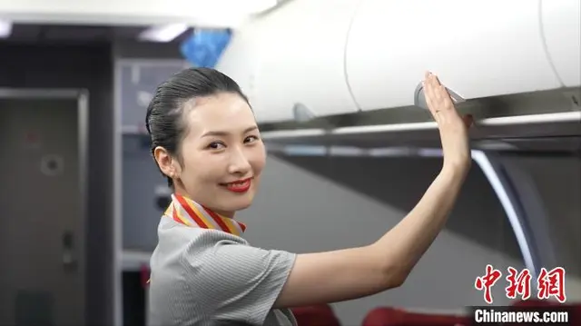 The picture shows Wang Yedan’s flight attendant’s work photo. Photo by Zhou Zhen, China News ...